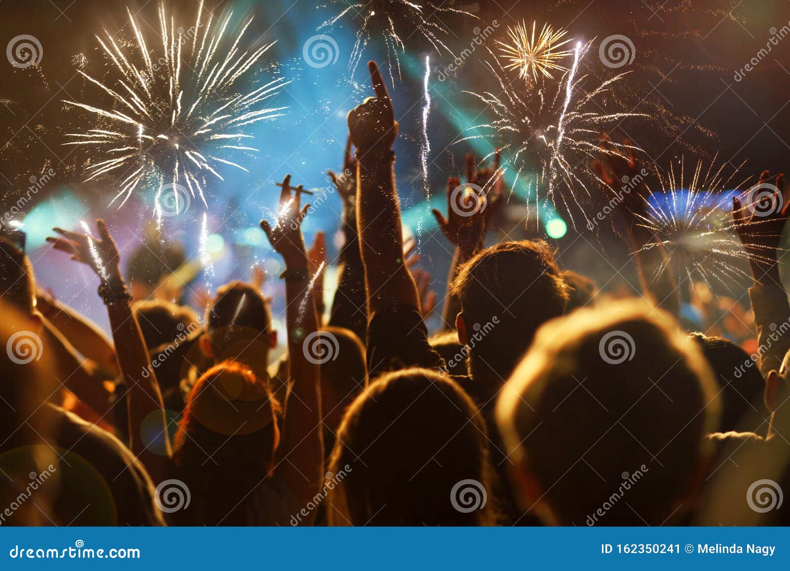 New Year Concept - Cheering Crowd and Fireworks Editorial Photo - Image ...