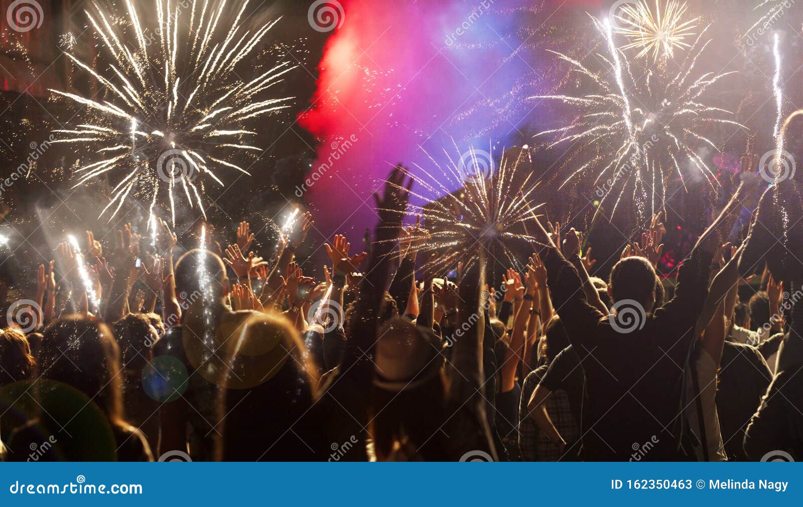 New Year Concept - Cheering Crowd and Fireworks Editorial Stock Photo ...