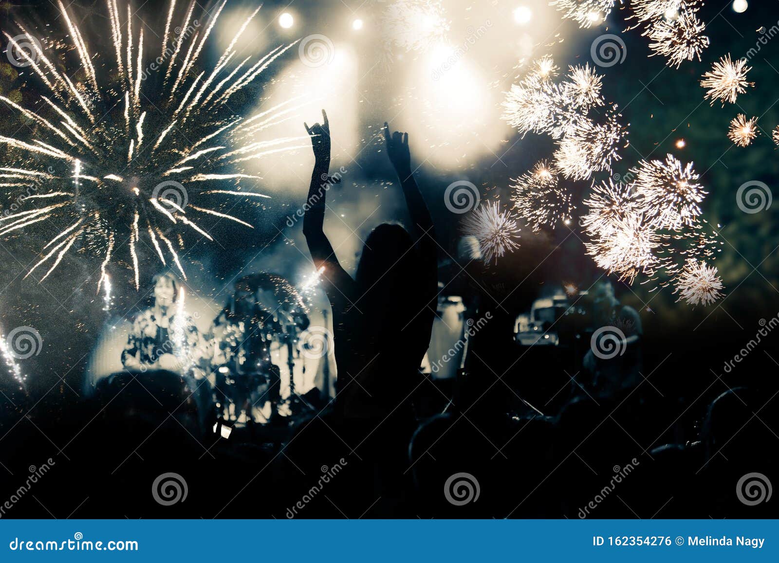 New Year Concept - Cheering Crowd and Fireworks Stock Photo - Image of ...