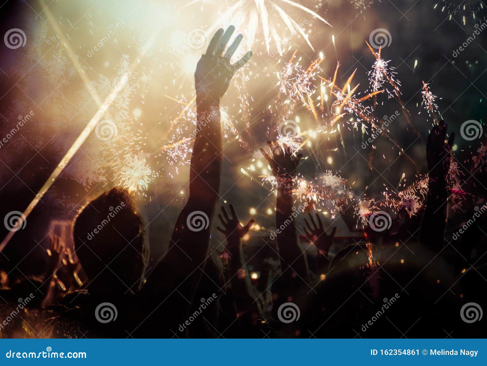 New Year Concept - Cheering Crowd and Fireworks Stock Image - Image of ...