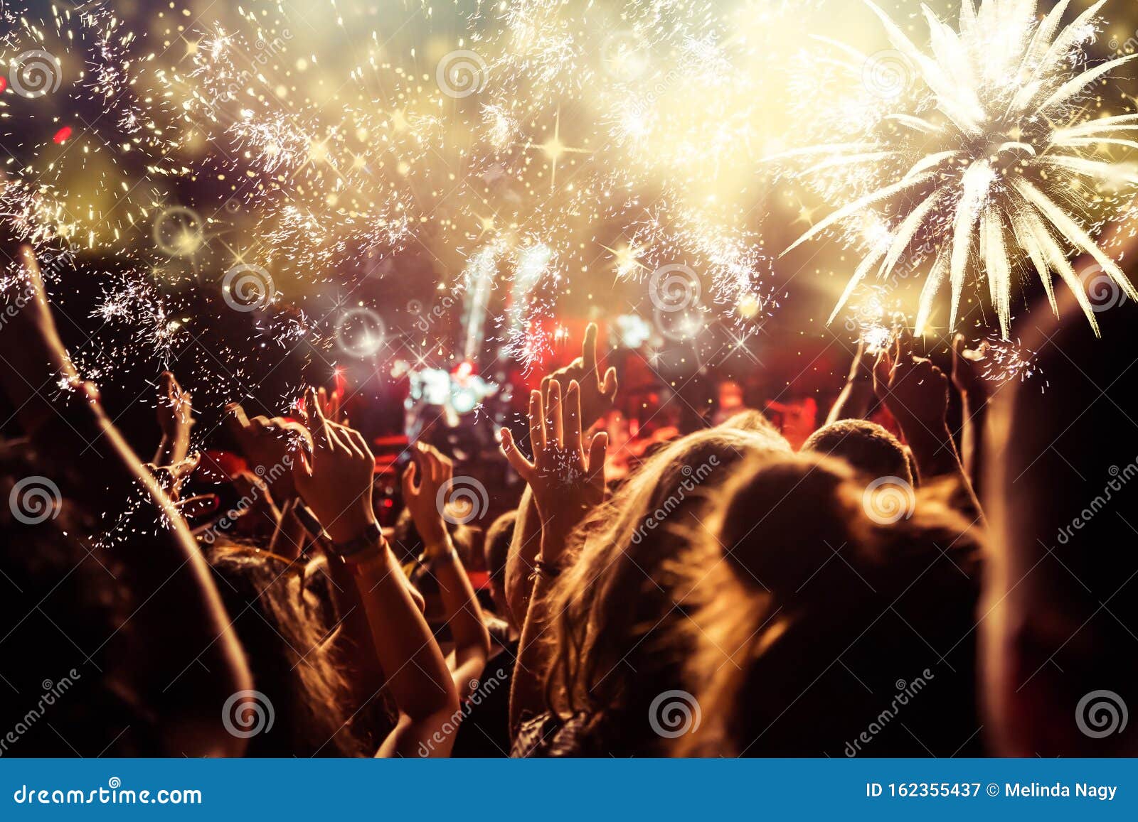 New Year Concept - Cheering Crowd and Fireworks Stock Image - Image of ...