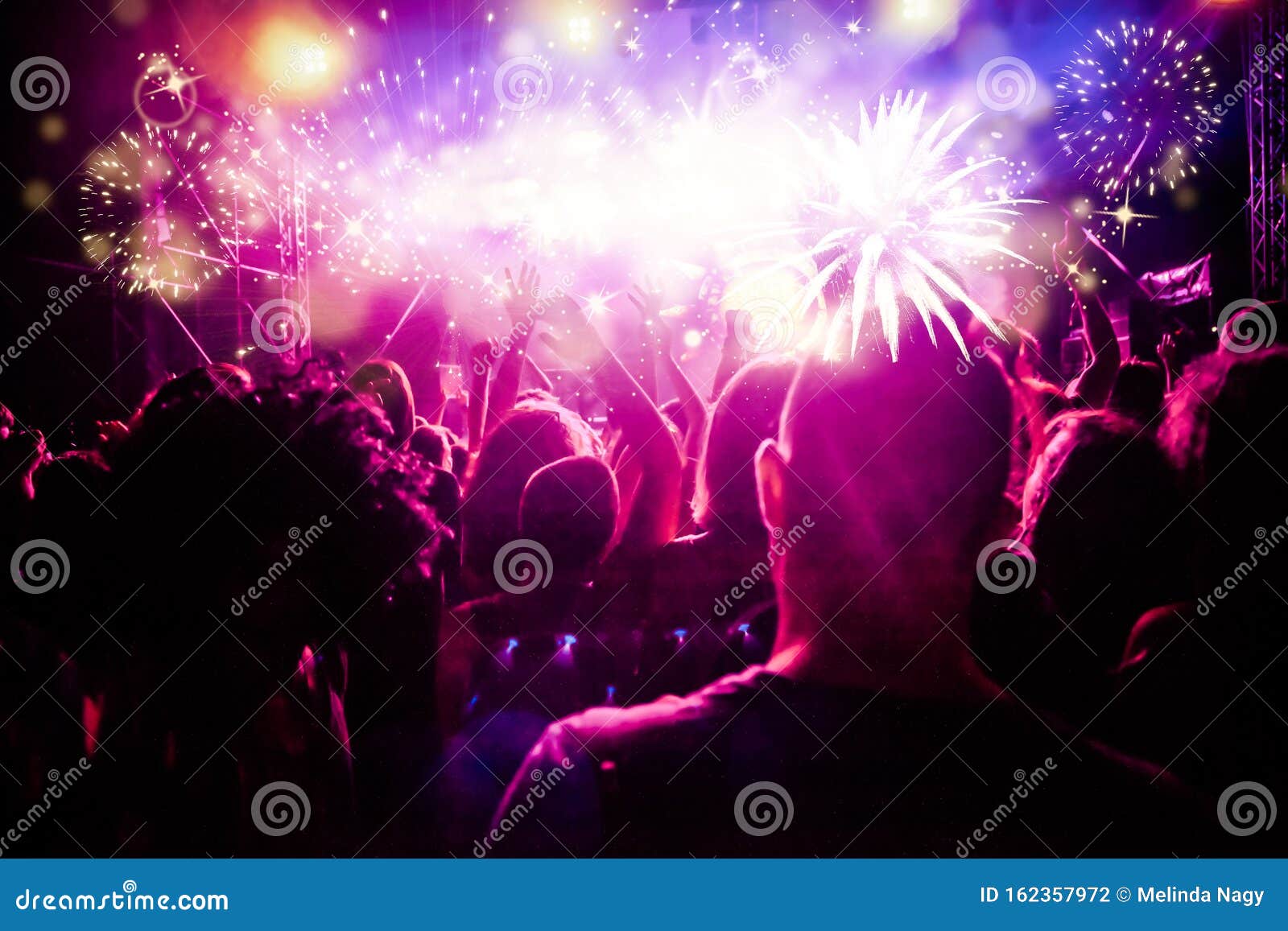 New Year Concept - Cheering Crowd and Fireworks Stock Photo - Image of ...