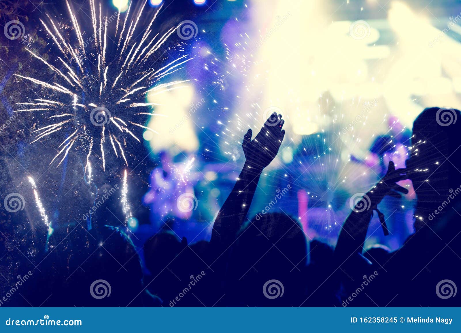 New Year Concept - Cheering Crowd and Fireworks Stock Image - Image of ...