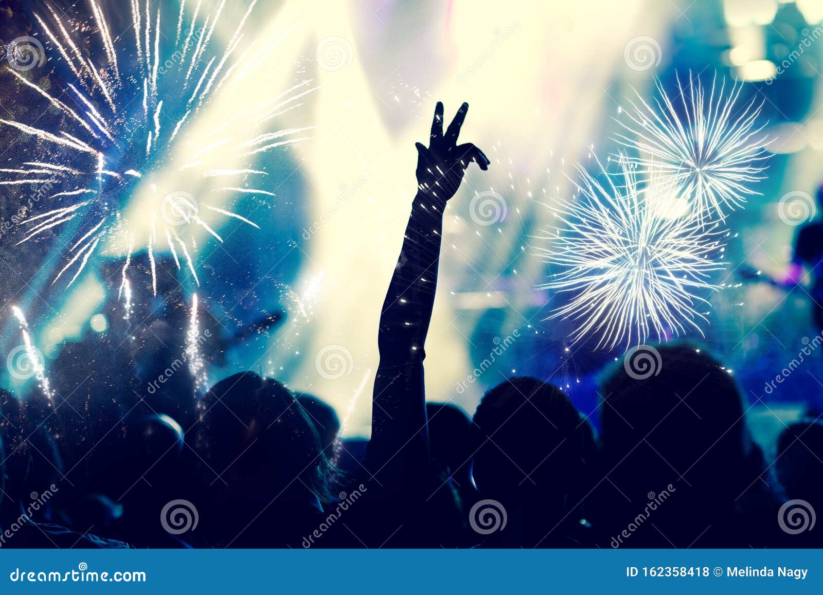 New Year Concept - Cheering Crowd and Fireworks Stock Photo - Image of ...