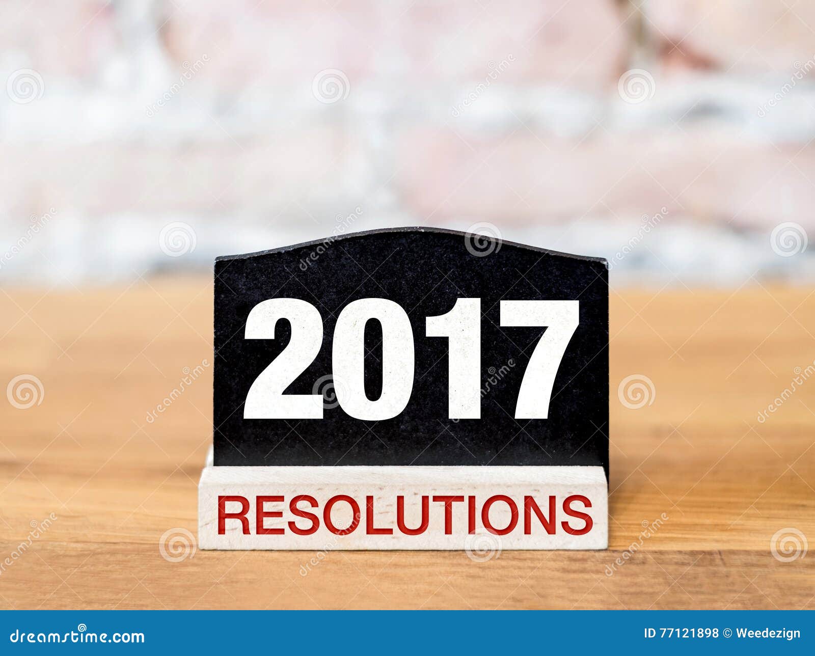 New Year 2017 Resolutions Text on Blackboard Sign on Wood Table Stock ...