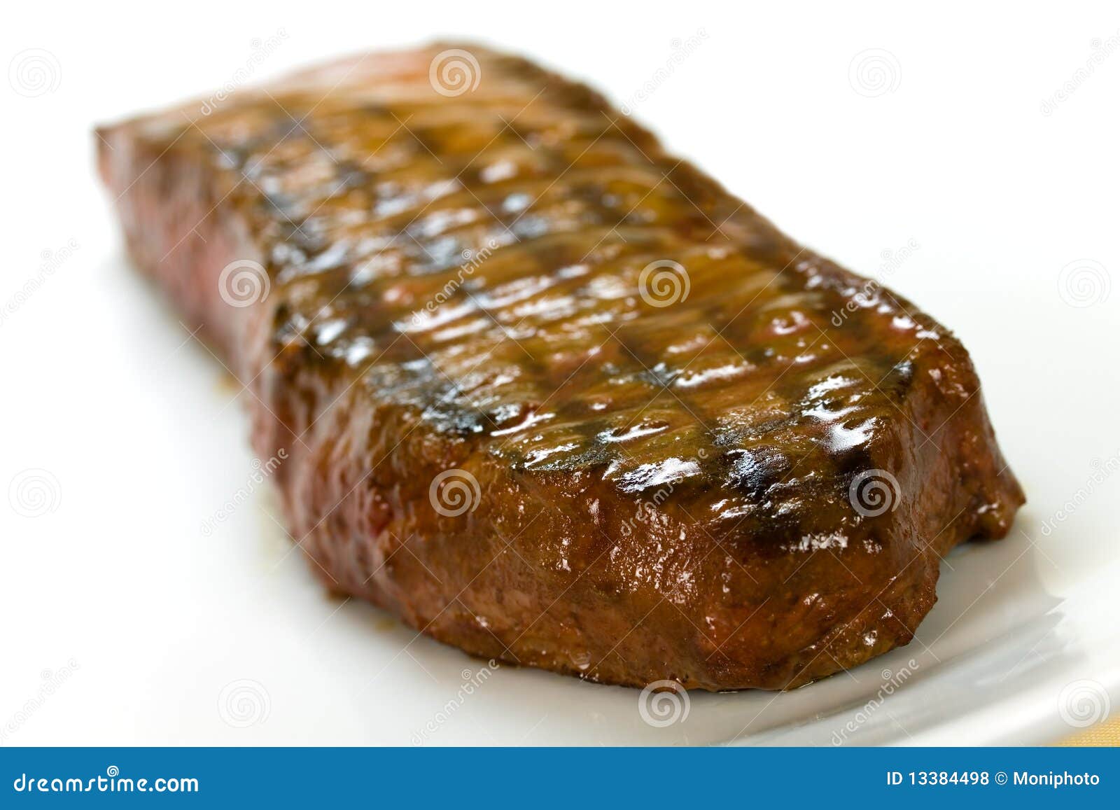 New York Steak- over plate stock photo. Image of cookery - 13384498