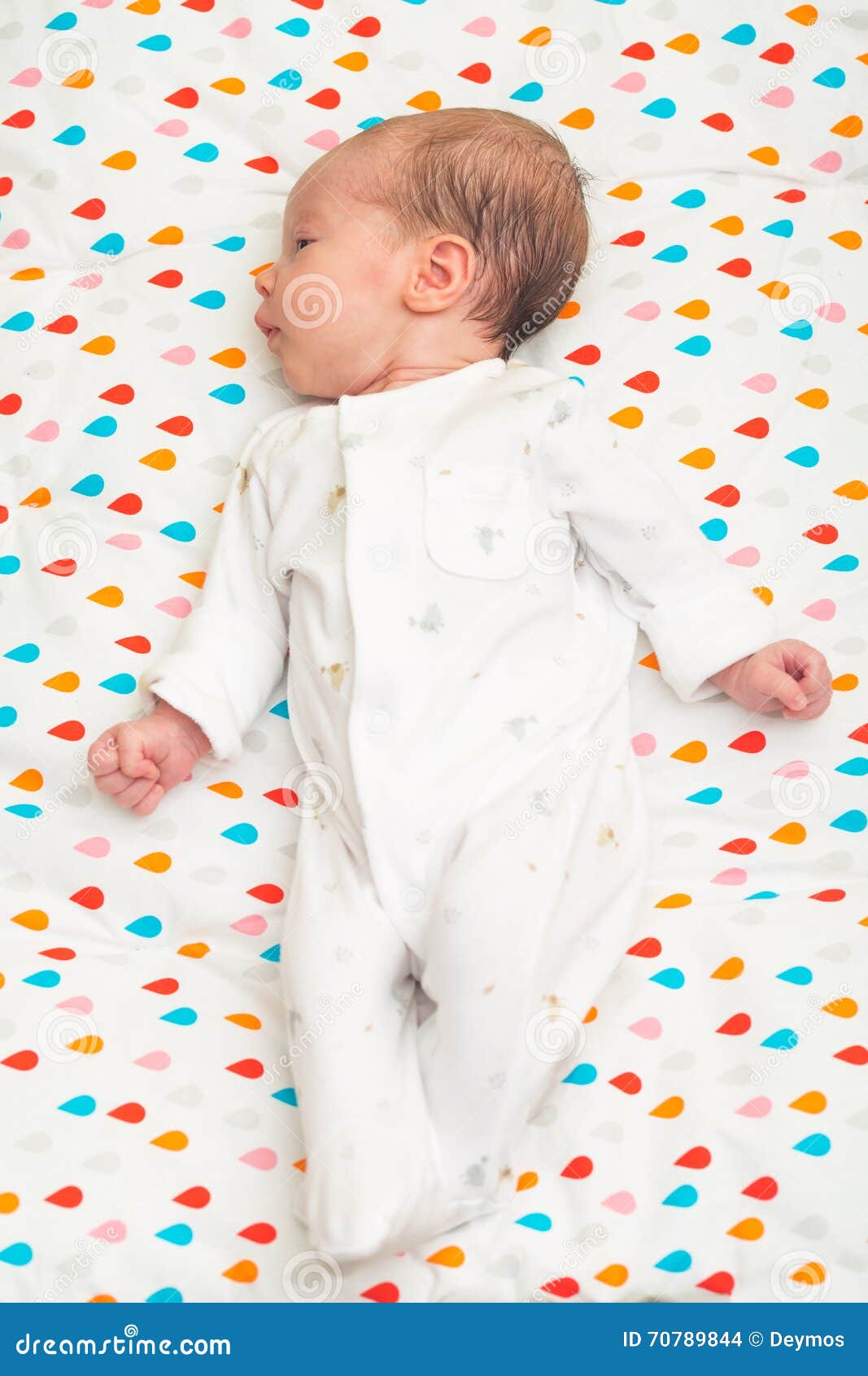 Newborn Baby Dressed in White Sleeping on Her Back Stock Photo - Image ...