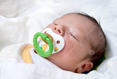 Newborn Baby with Pacifier Sleeping Stock Photo - Image of candid ...