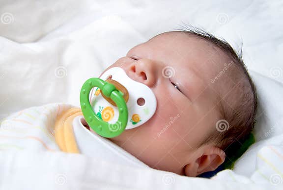 Newborn Baby with Pacifier Sleeping Stock Photo - Image of candid ...