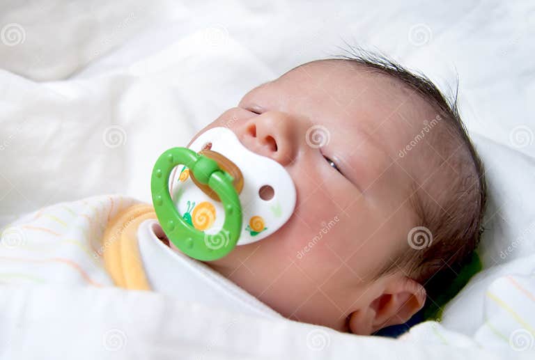 Newborn Baby with Pacifier Sleeping Stock Photo - Image of candid ...