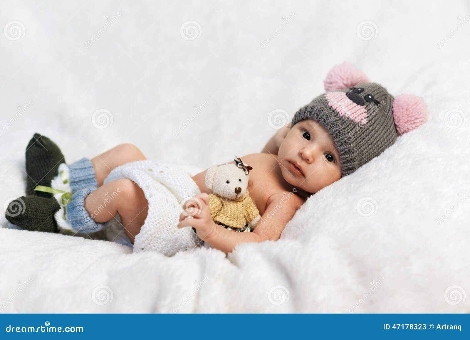 Newborn Baby with Teddy Bear in a Knitted Hat Stock Image - Image of ...