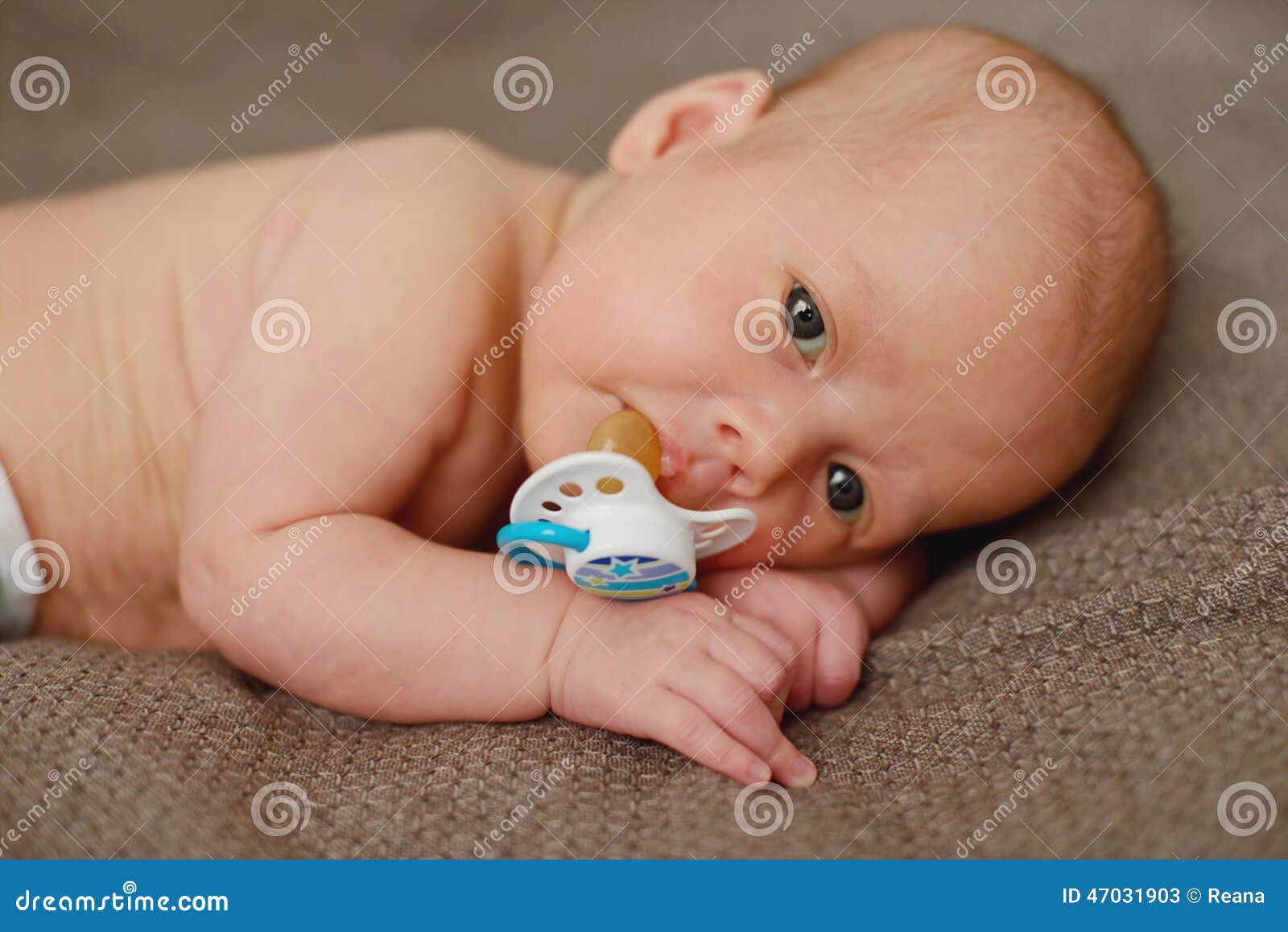 Newborn with dummy stock image. Image of expression, cute - 47031903