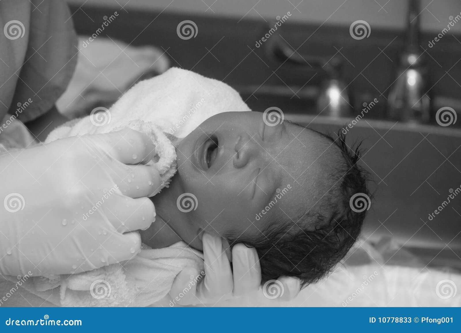 Newborn first bath stock image. Image of ethnic, baby - 10778833