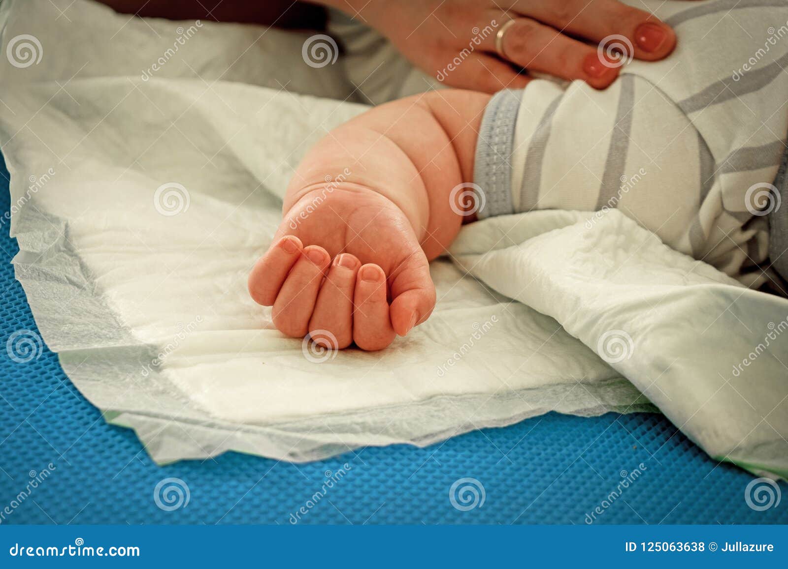 Small Handle of the Sleeping Baby. Newborn Hand. Close Up of Little Boy ... Small Handle of the Sleeping Baby. Newborn Hand. Close Up of Little Boy ...