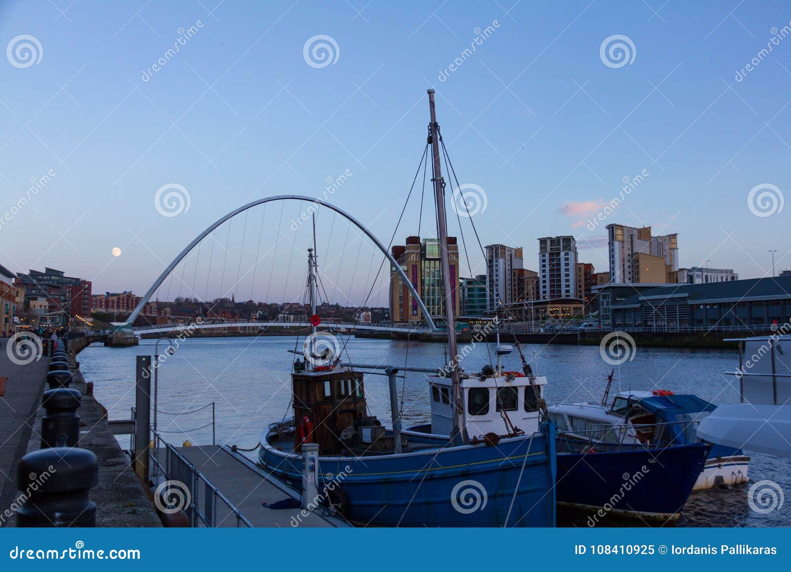 Newcastle Quayside with Gateshead Millenium Bridge and Boat in S ...