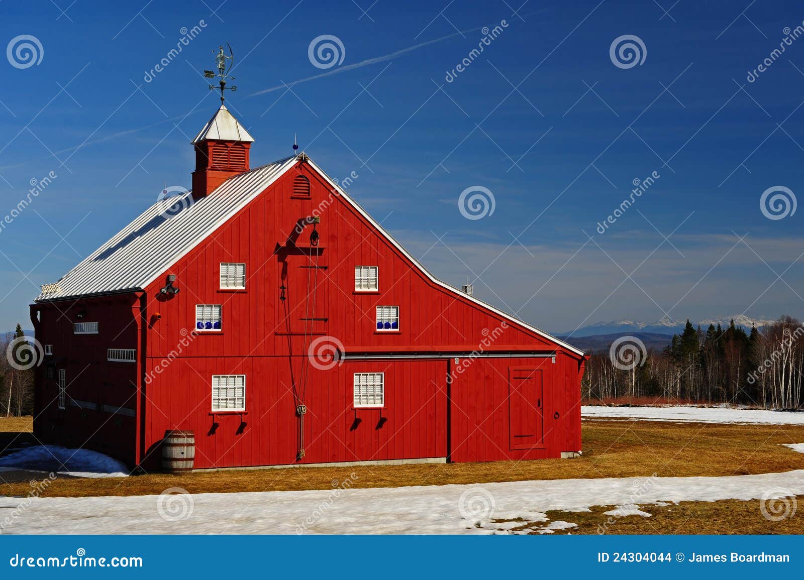 A Newer Bright Red Barn and White Mountains Stock Photo - Image of ...