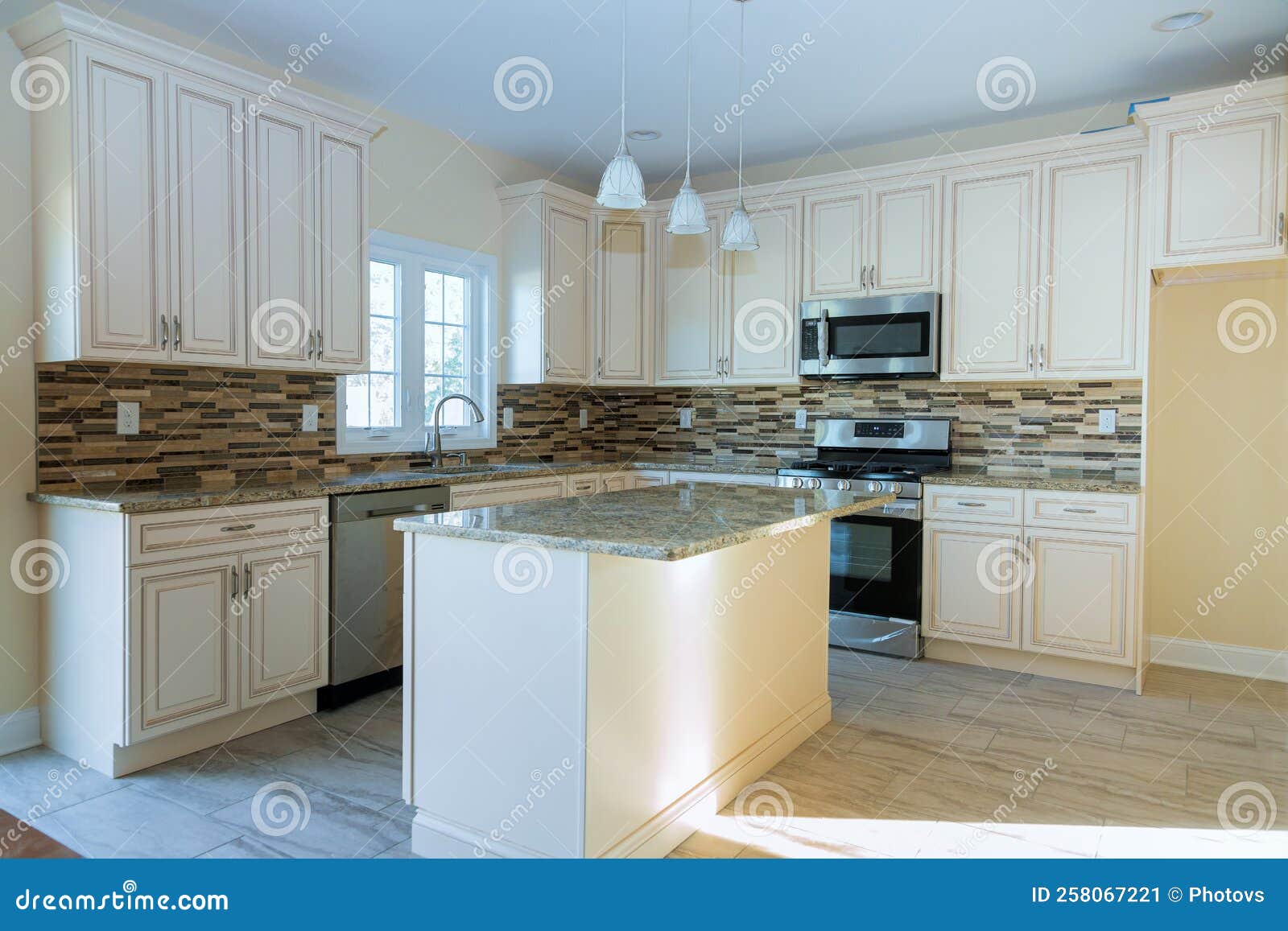 A Newly Constructed House Was Installed with White Kitchen Cabinets As ...