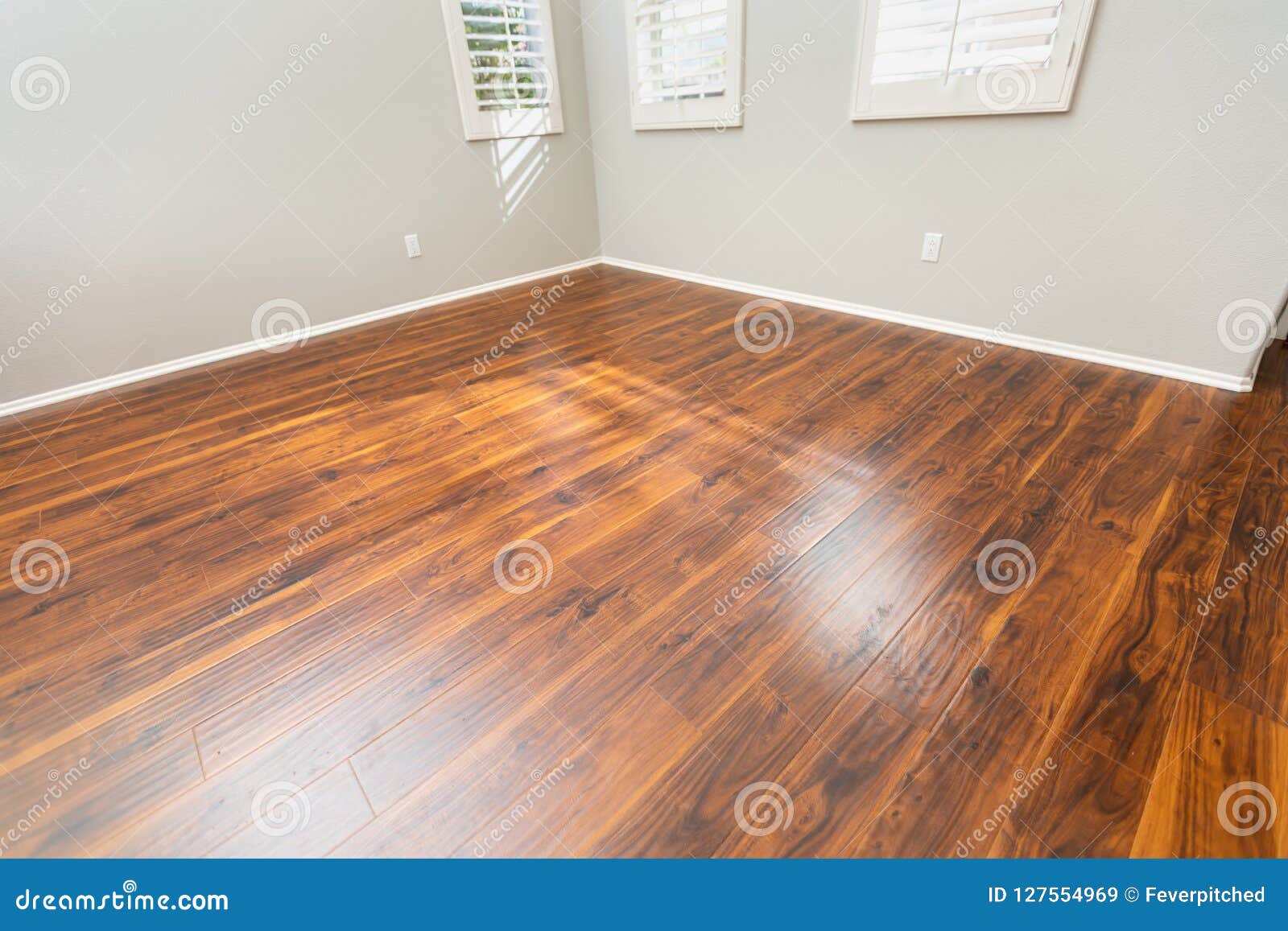 Newly Installed Brown Laminate Flooring and Baseboards in Home Stock ...