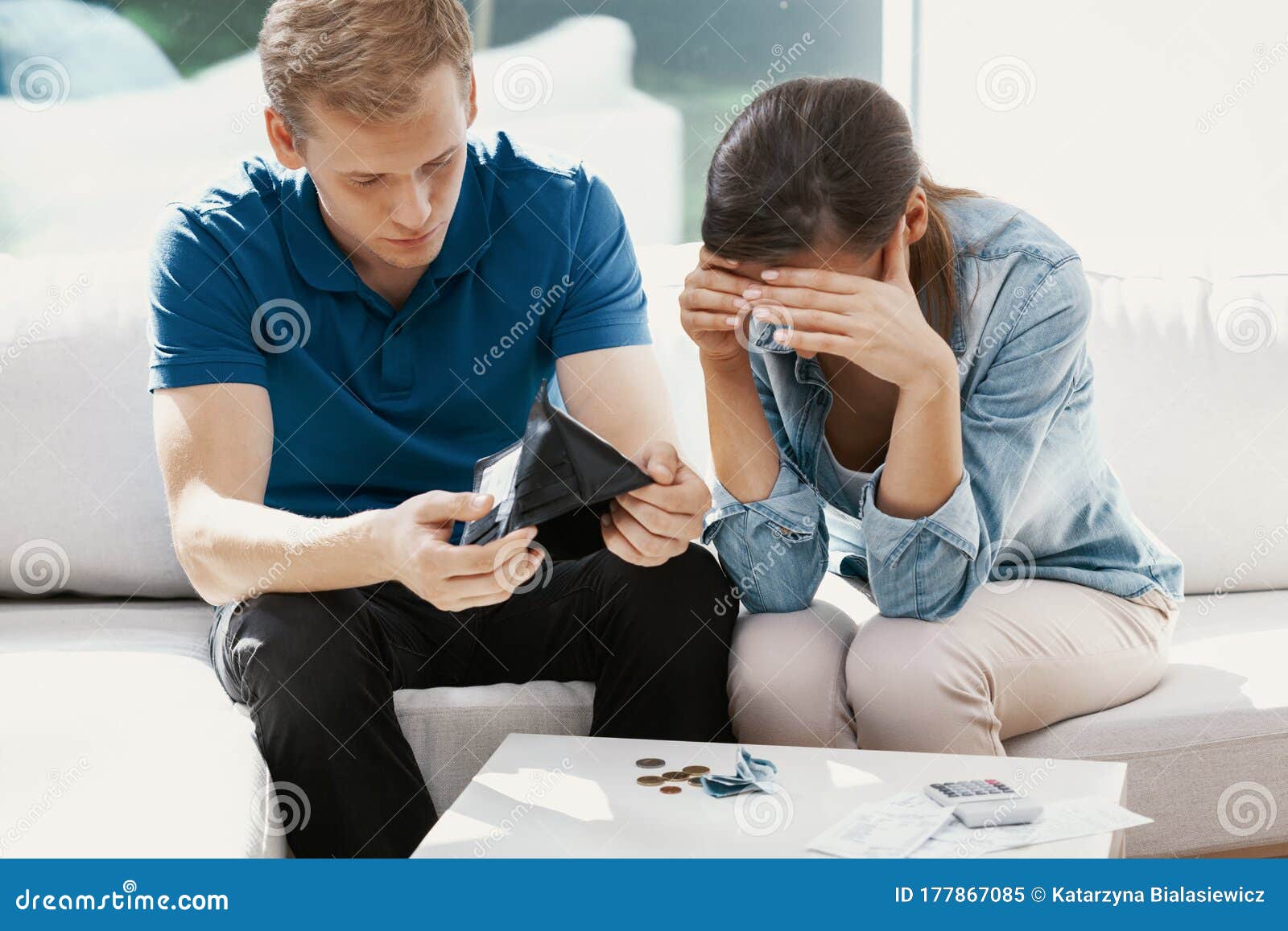 Married Couple Sitting at Home Looking at Their Finance Problems Stock ...