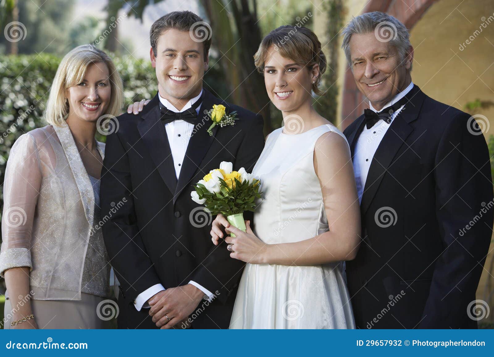 Newly Married Couple Standing with Parents Stock Photo - Image of baby ...