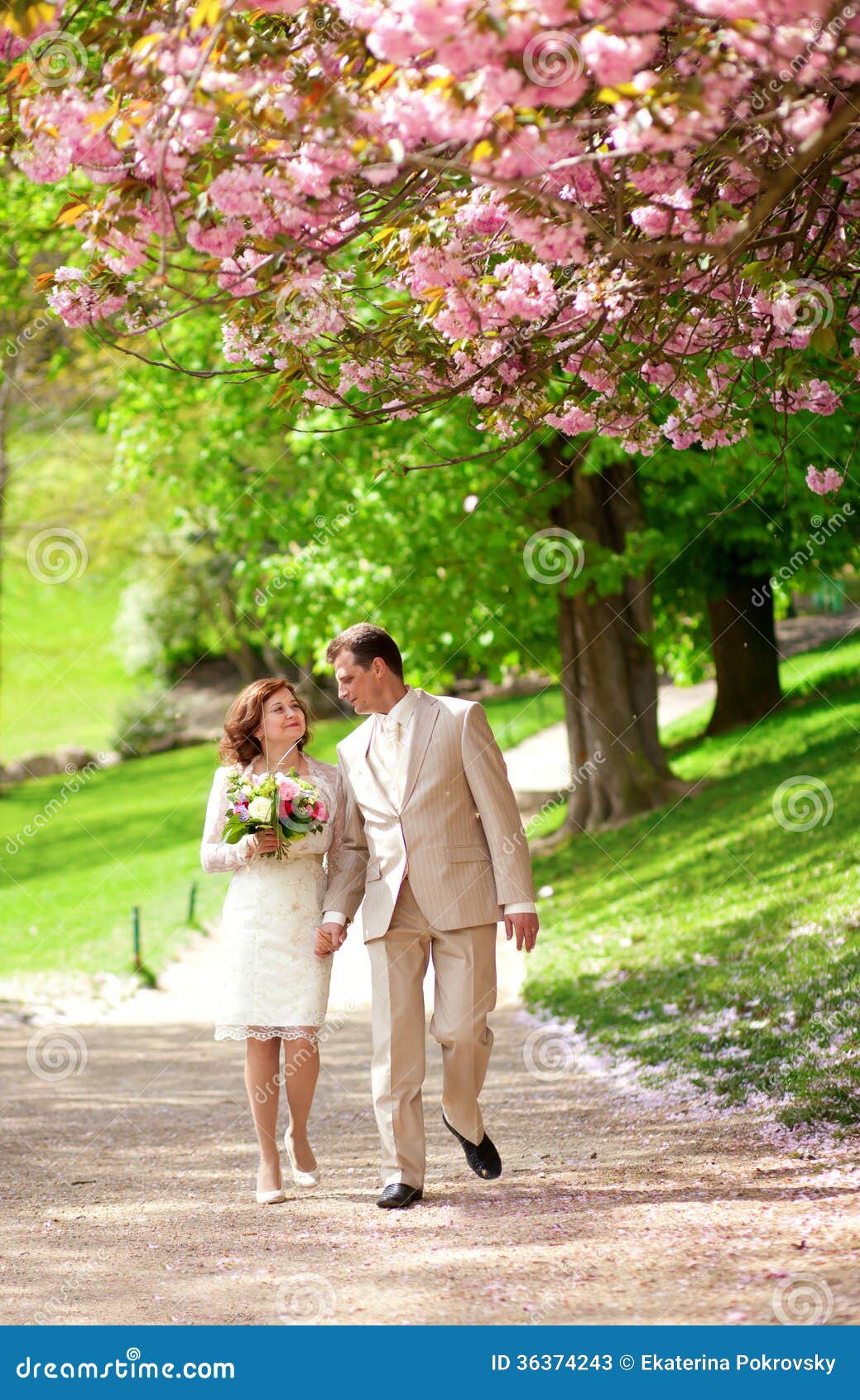 Newlywed Couple Having a Stroll in Park at Spring Stock Image - Image ...