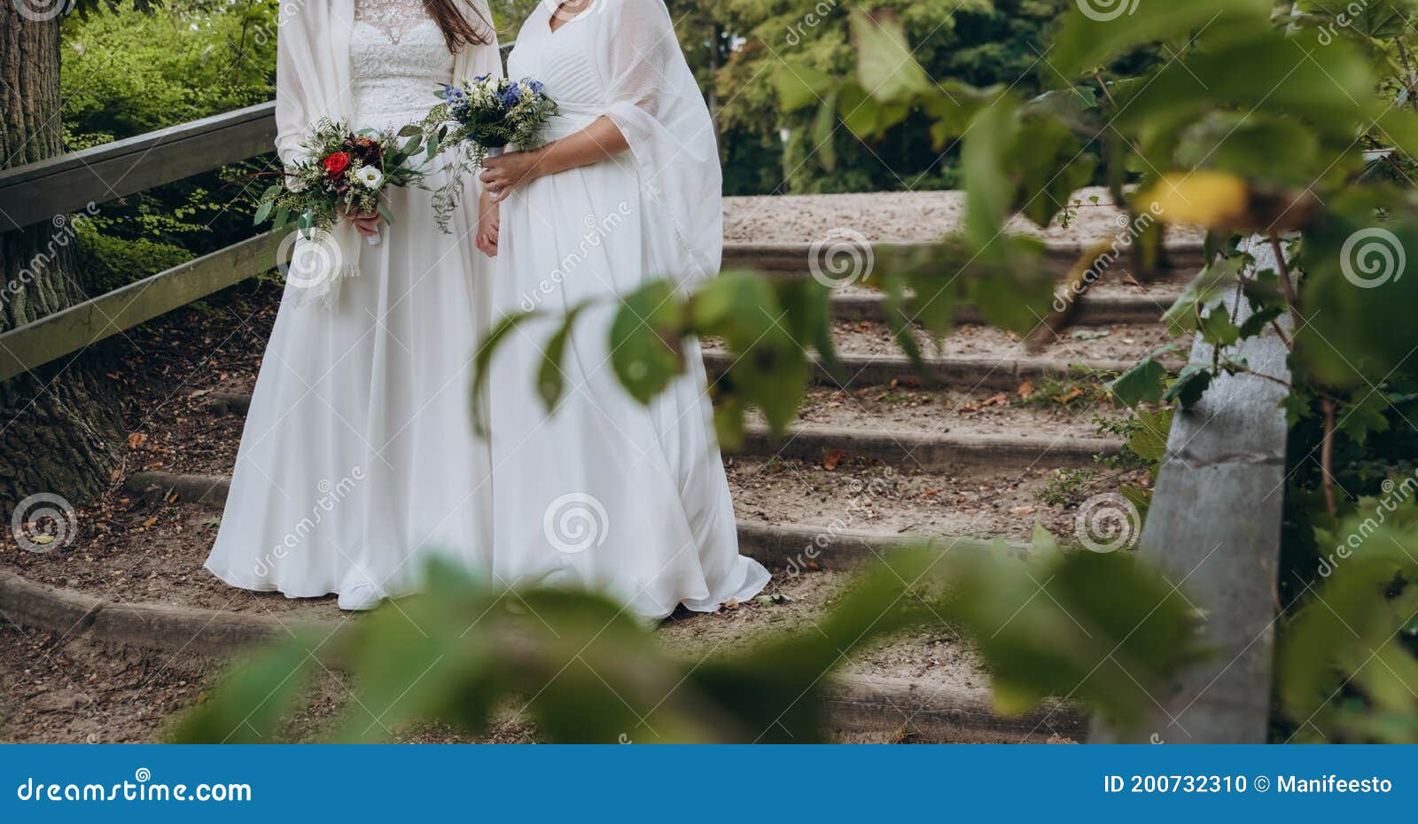Newlywed Lesbian Couple On Their Happy Wedding Day Wearing White