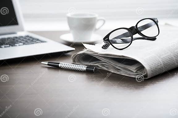 Newspaper with Computer on Table Stock Image - Image of morning ...