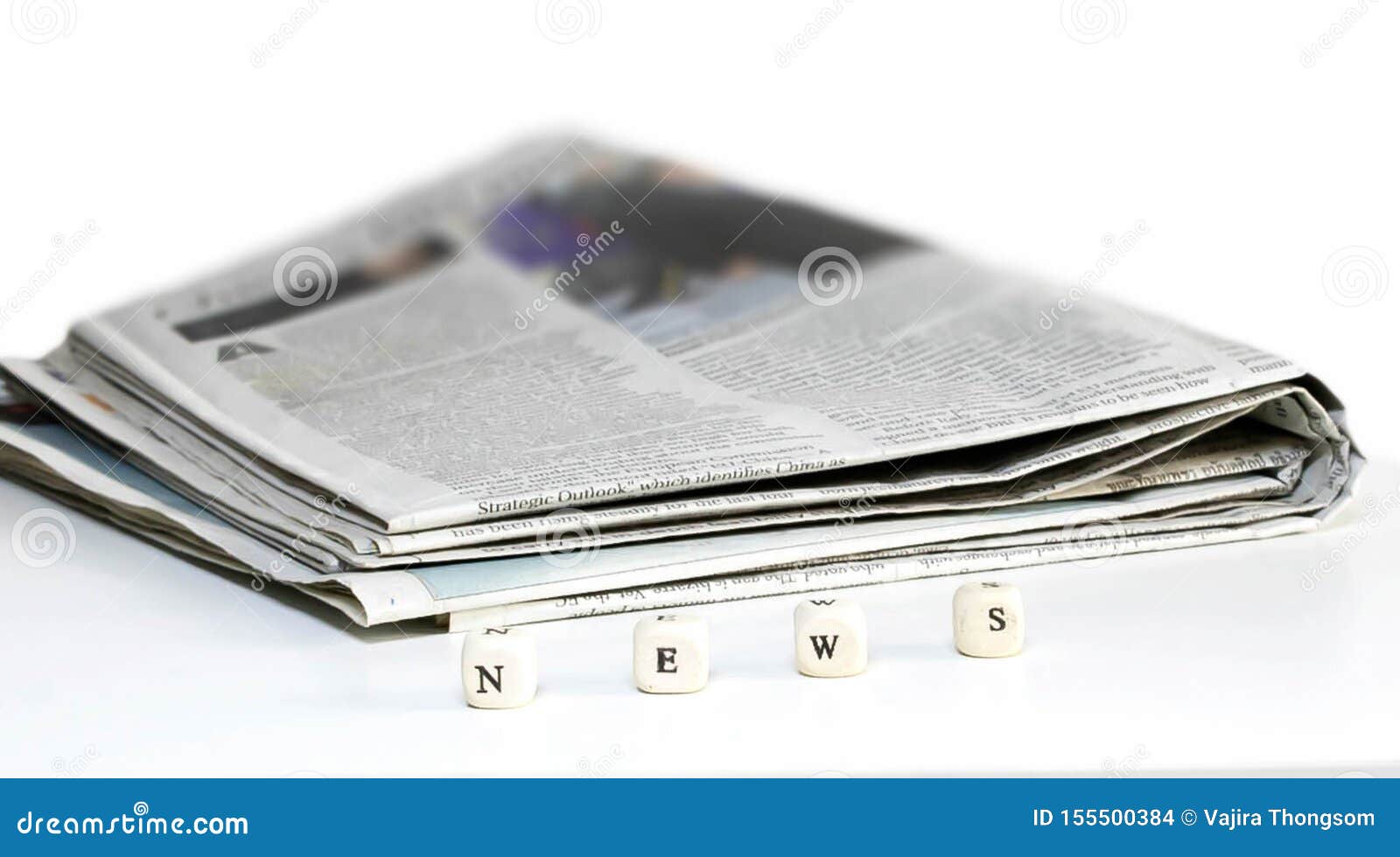 Newspaper Folded with Wooden Abc Text on White Background Stock Photo ...