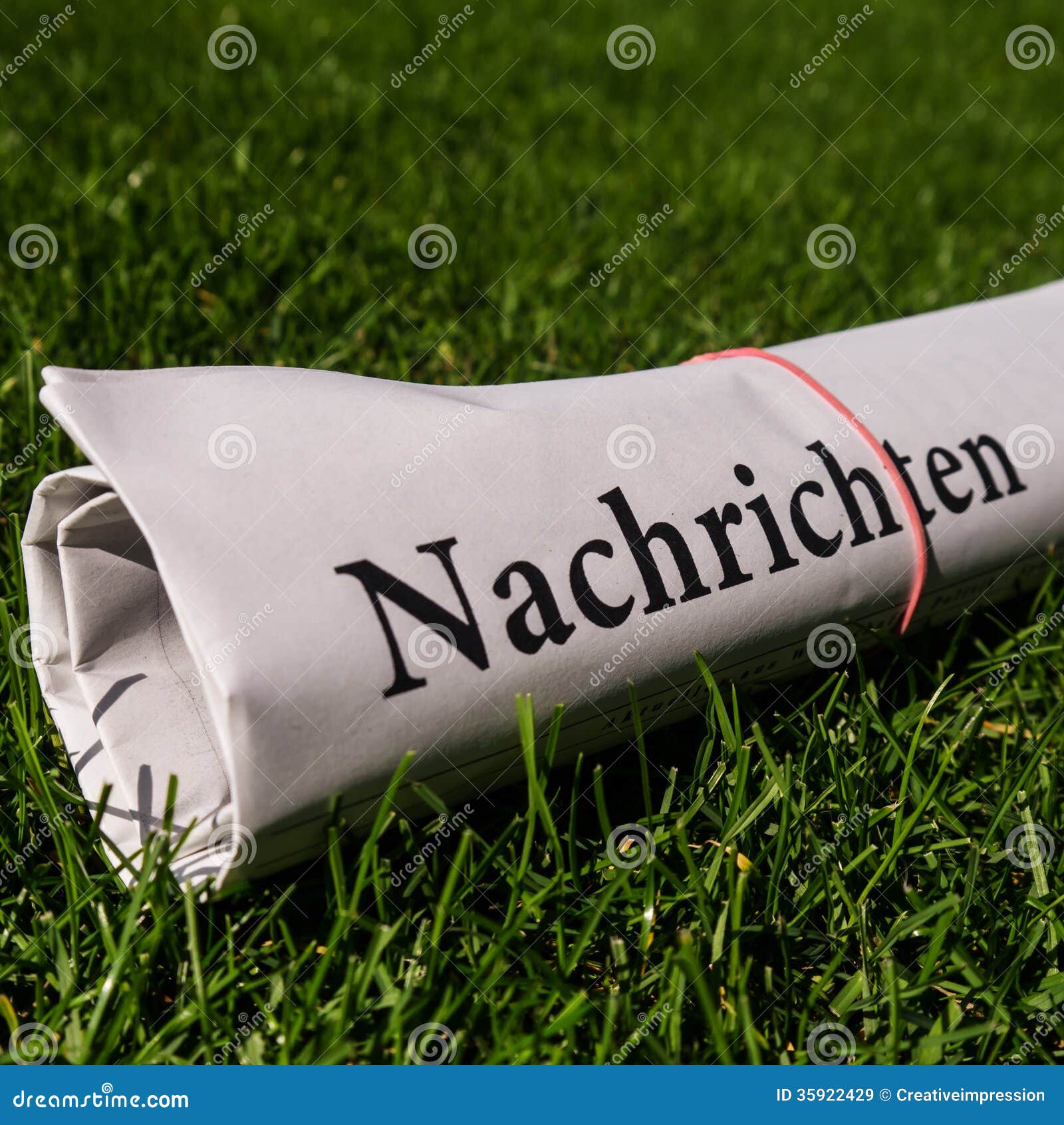 Newspaper on green madow stock image. Image of title - 35922429