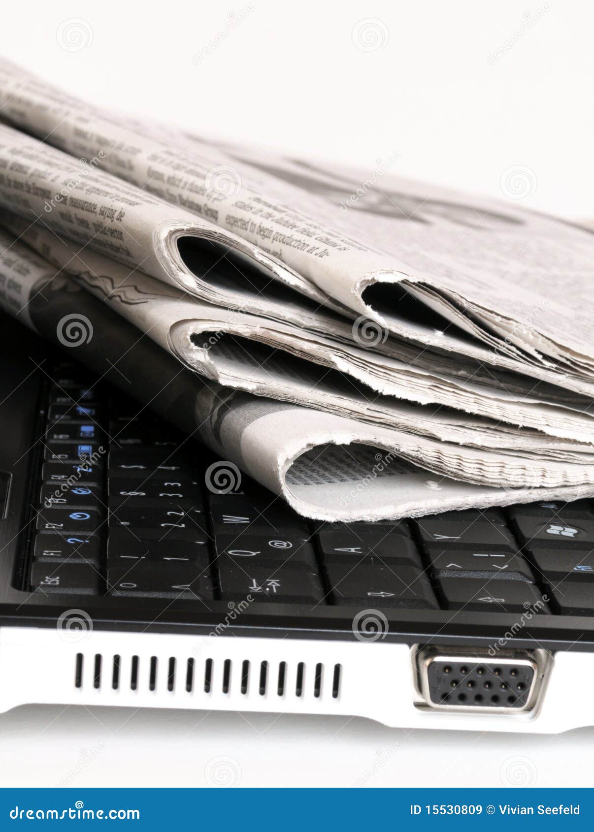 Newspaper on laptop stock image. Image of electronics - 15530809