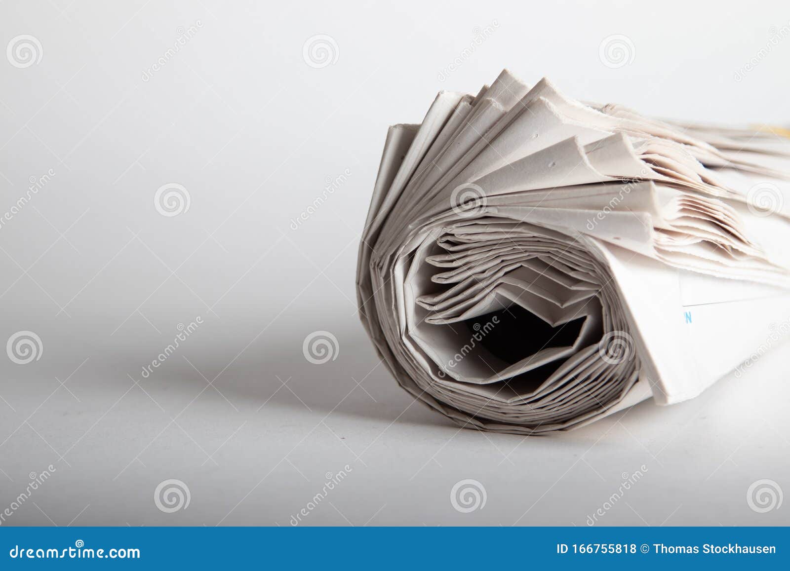 Newspaper Roll with White Background, Negative Space Stock Photo ...