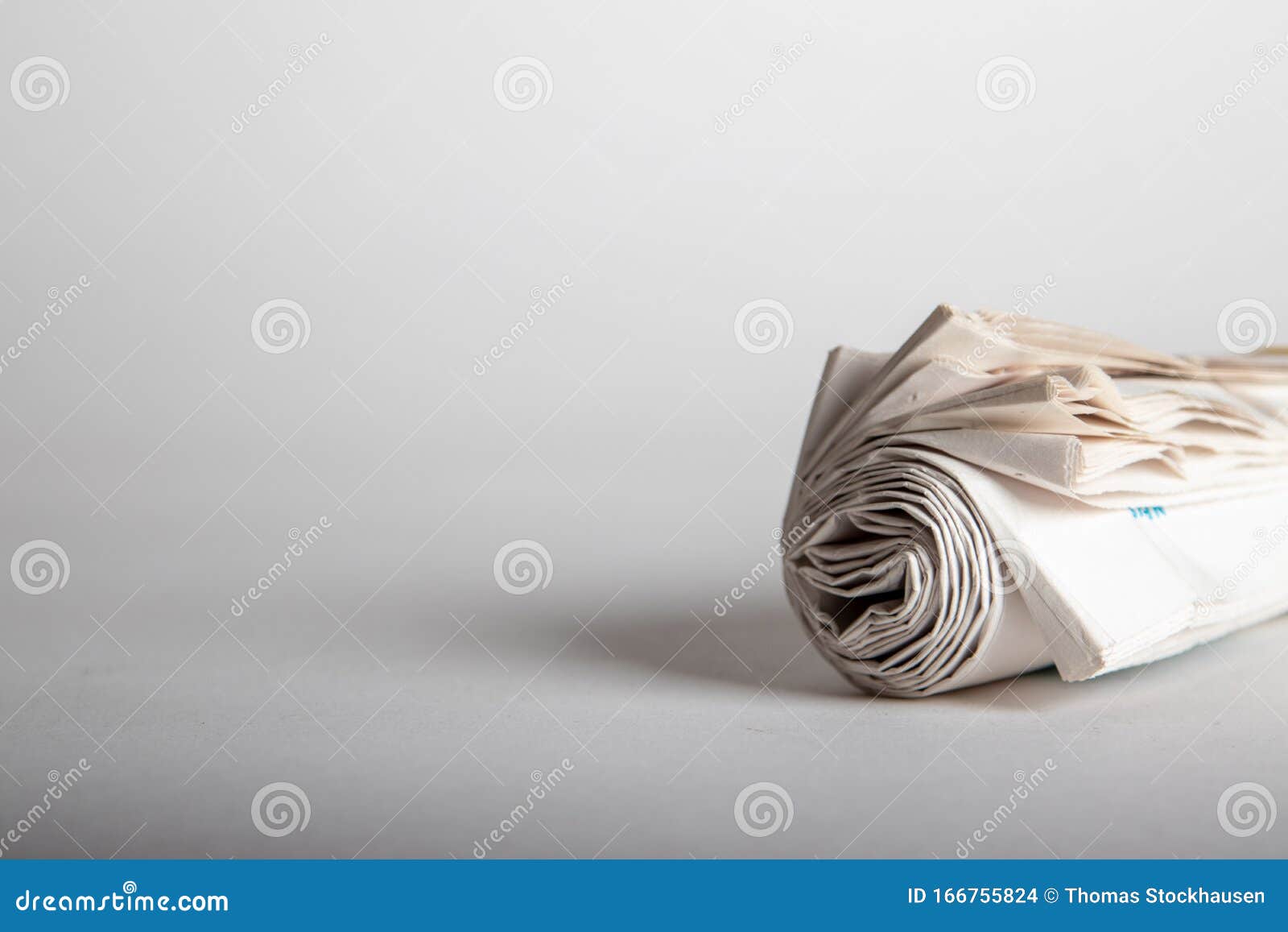 Newspaper Roll with White Background, Negative Space Stock Photo ...
