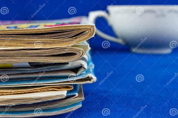 Newspaper Stack on Blue Background Stock Photo - Image of newspaper ...