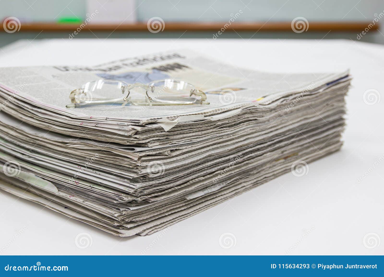 Newspaper Stack on White Table Stock Image - Image of breaking, text ...