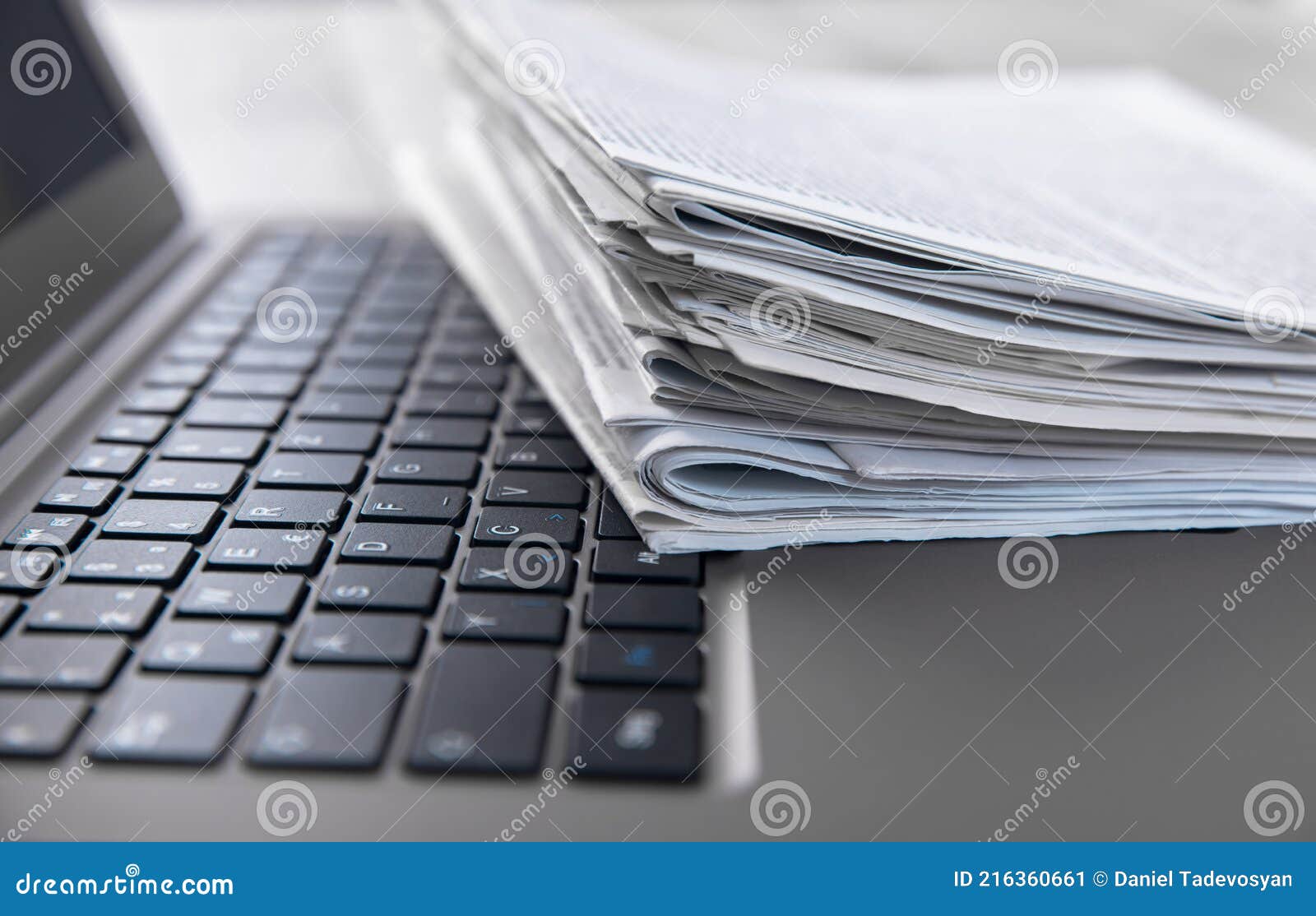 Newspapers and laptop stock image. Image of paper, newspaper - 216360661