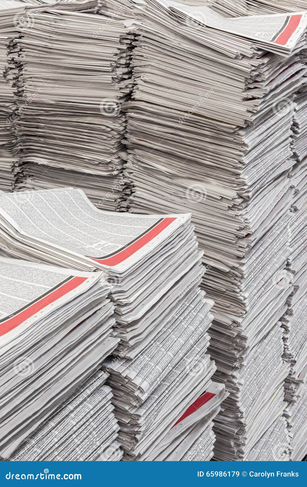 Newspapers in tall stacks stock image. Image of newspaper - 65986179