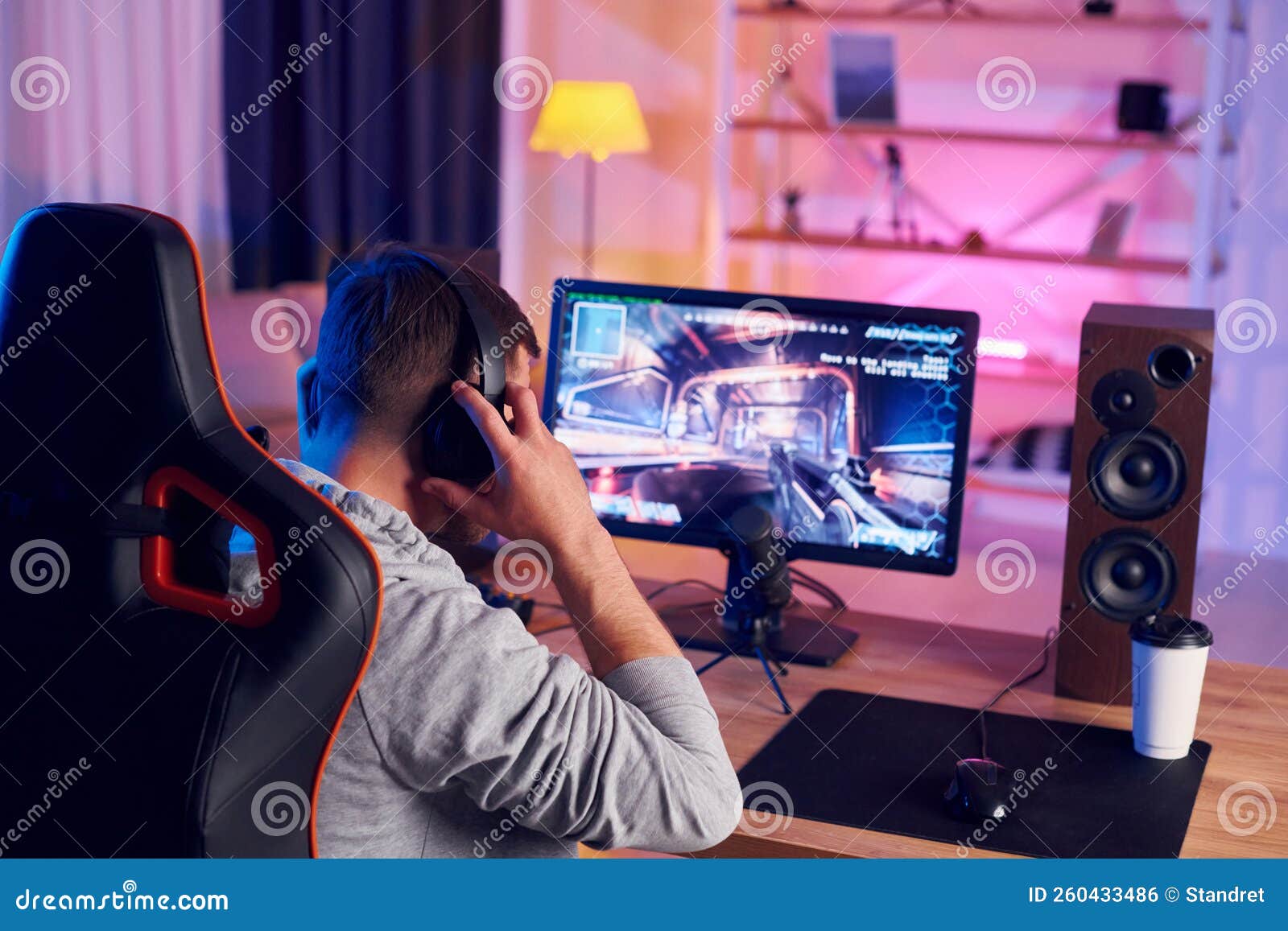 Next Gen Graphics. Online Streamer Playing FPS Shooter Game at Home ...