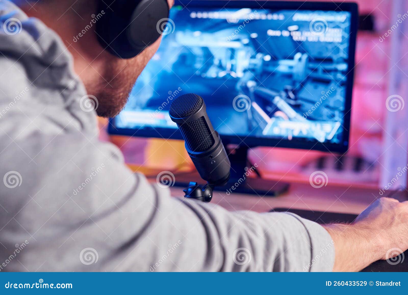 Next Gen Graphics. Online Streamer Playing FPS Shooter Game at Home ...