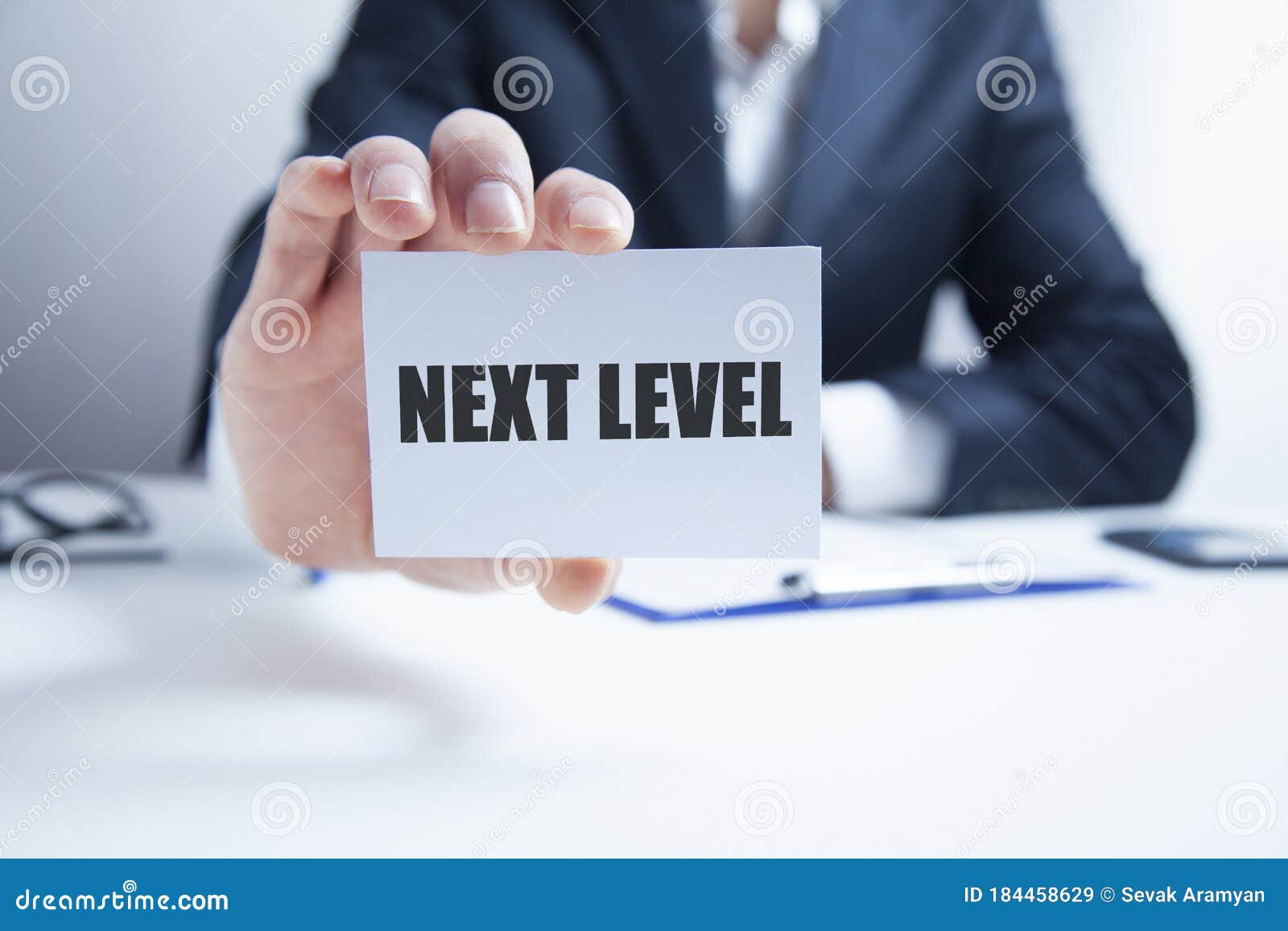 Next Level Text on Card on Man Hand Stock Image - Image of hand, next ...