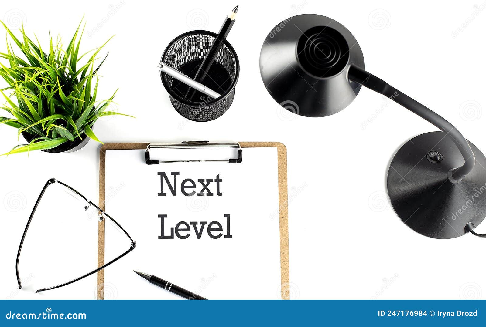 NEXT LEVEL Text on a Clipboard on the White Background Stock Photo ...