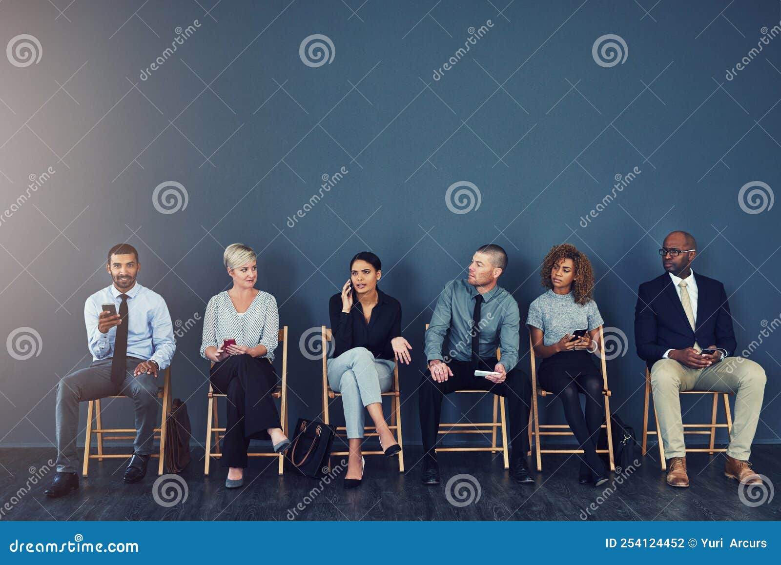 Next in Line for a New Job. Studio Shot of a Group of Businesspeople ...