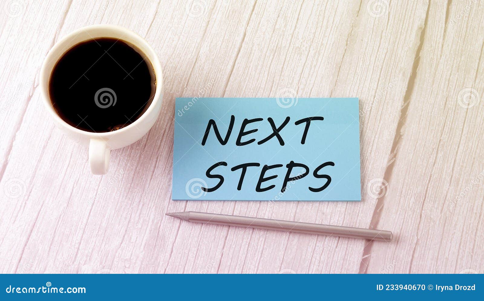 NEXT STEPS Text on the Blue Sticker with Cofee and Pen Stock Photo ...