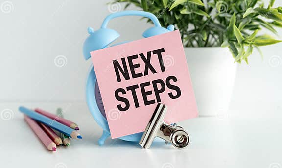 Next Steps Text on Clock. Text on Office Paper Notepad Stock Photo ...