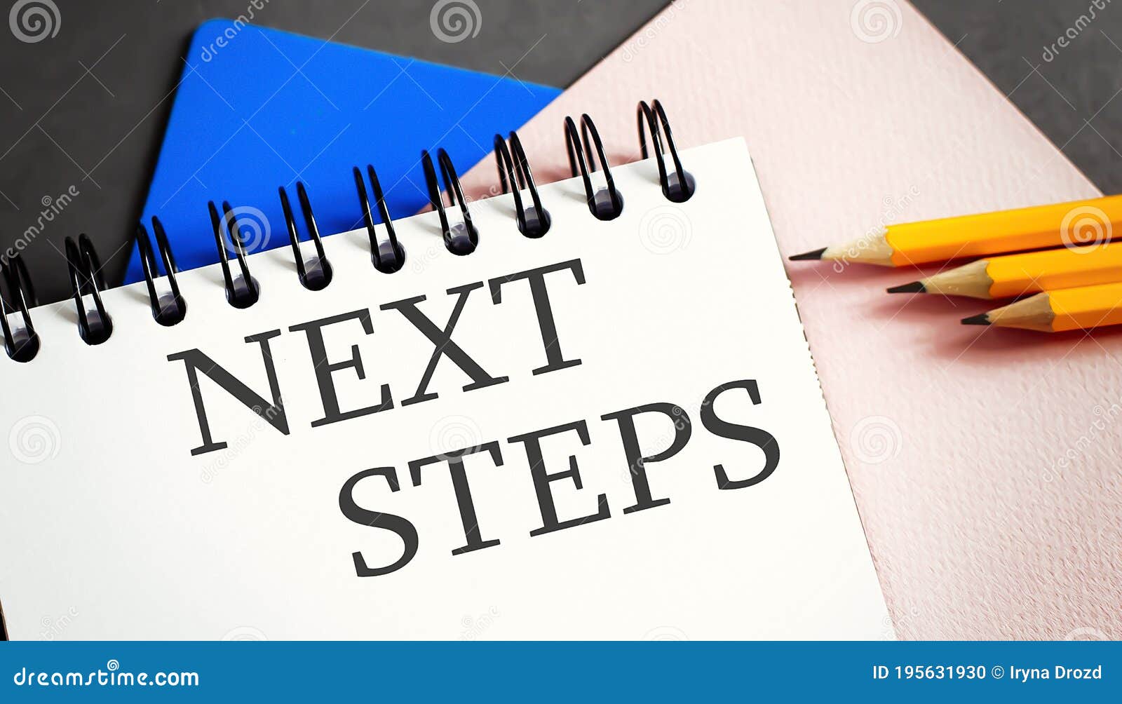 NEXT STEPS Text in the Office Notebook with Office Tools Stock Photo ...