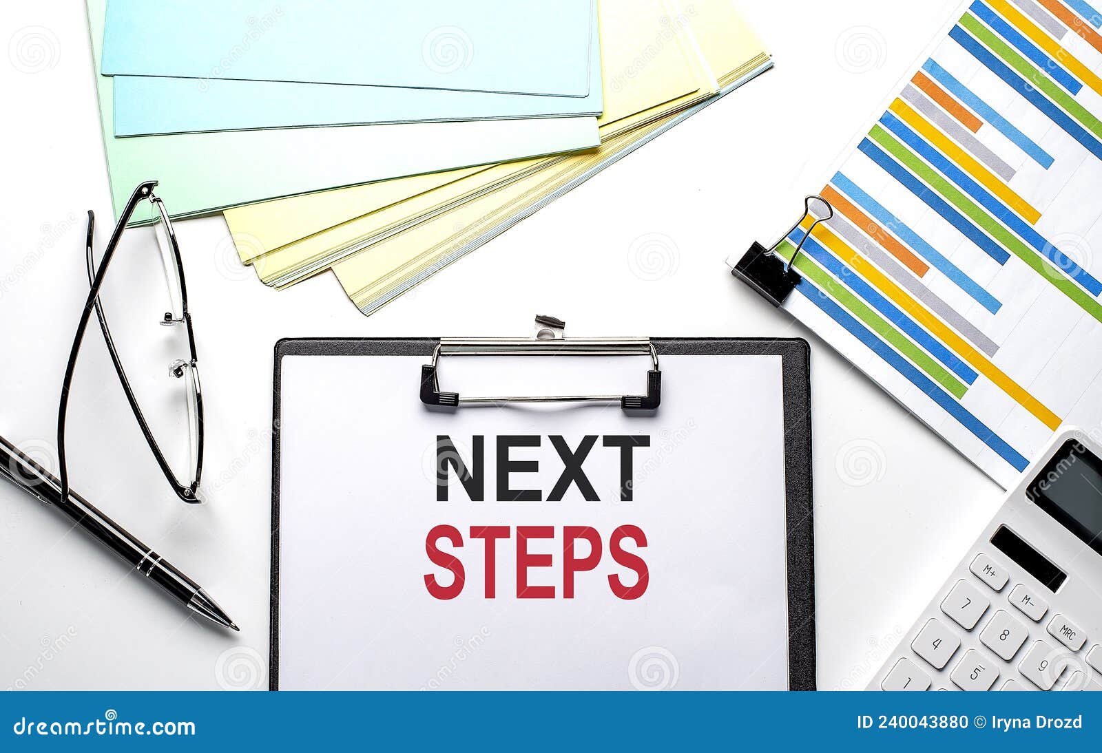 NEXT STEPS Text on Paper Sheet with Chart,color Paper and Calculator ...