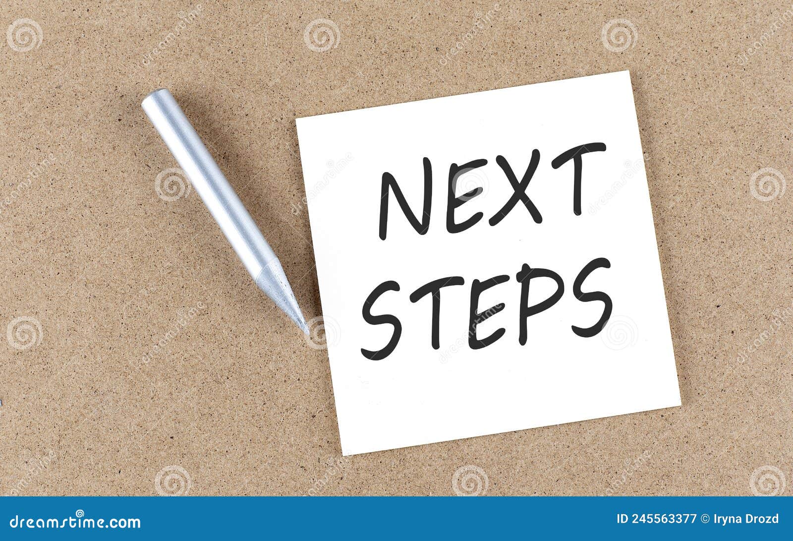 NEXT STEPS Text on Sticky Note on Cork Board with Pencil Stock Image ...