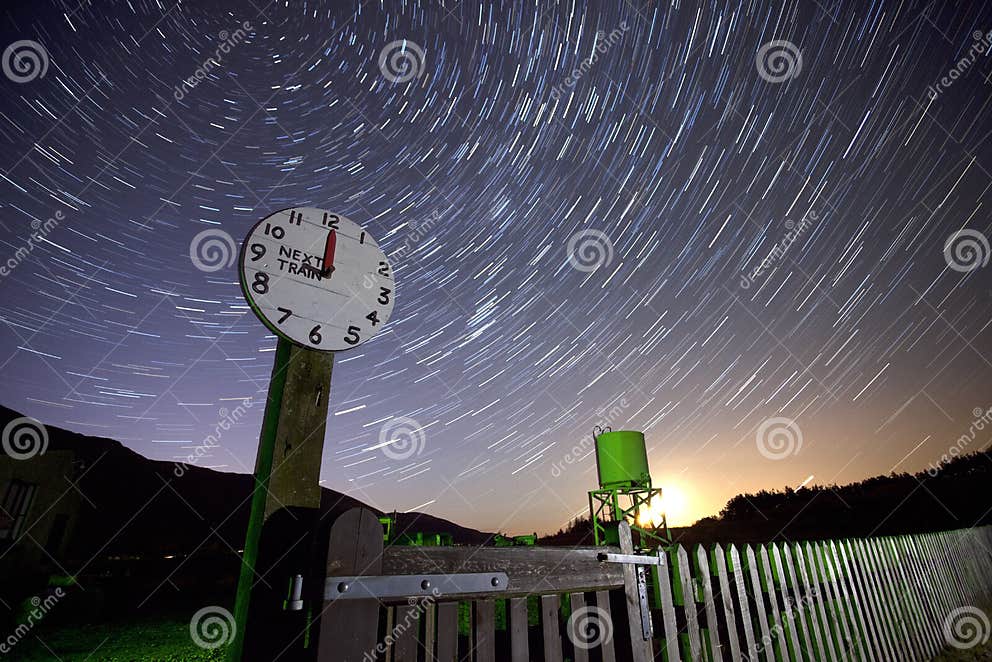 Next train clock at night stock image. Image of abstract - 21790215