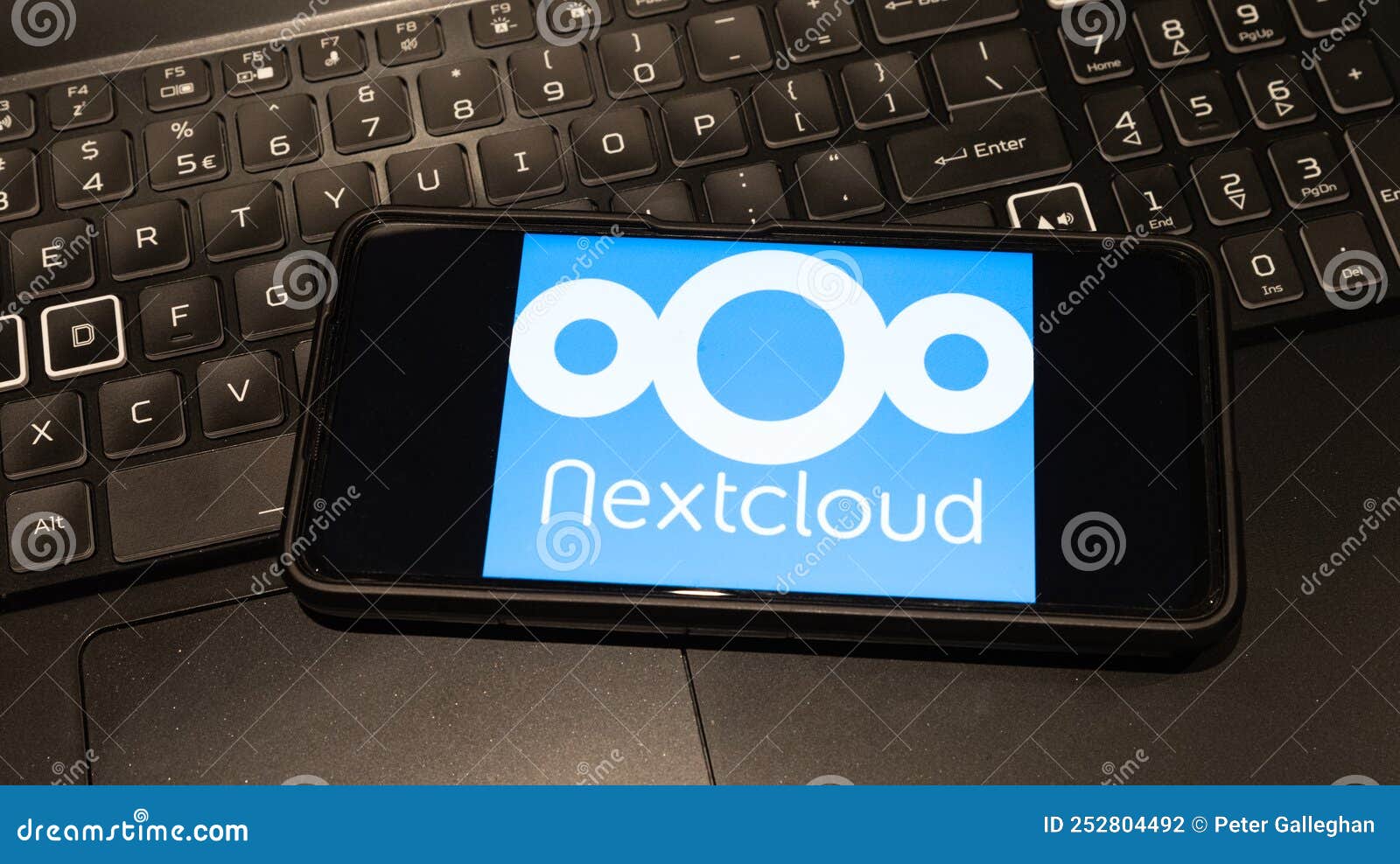 Nextcloud Logo on Mobile Phone , Background is a Keyboard , Sydney ...
