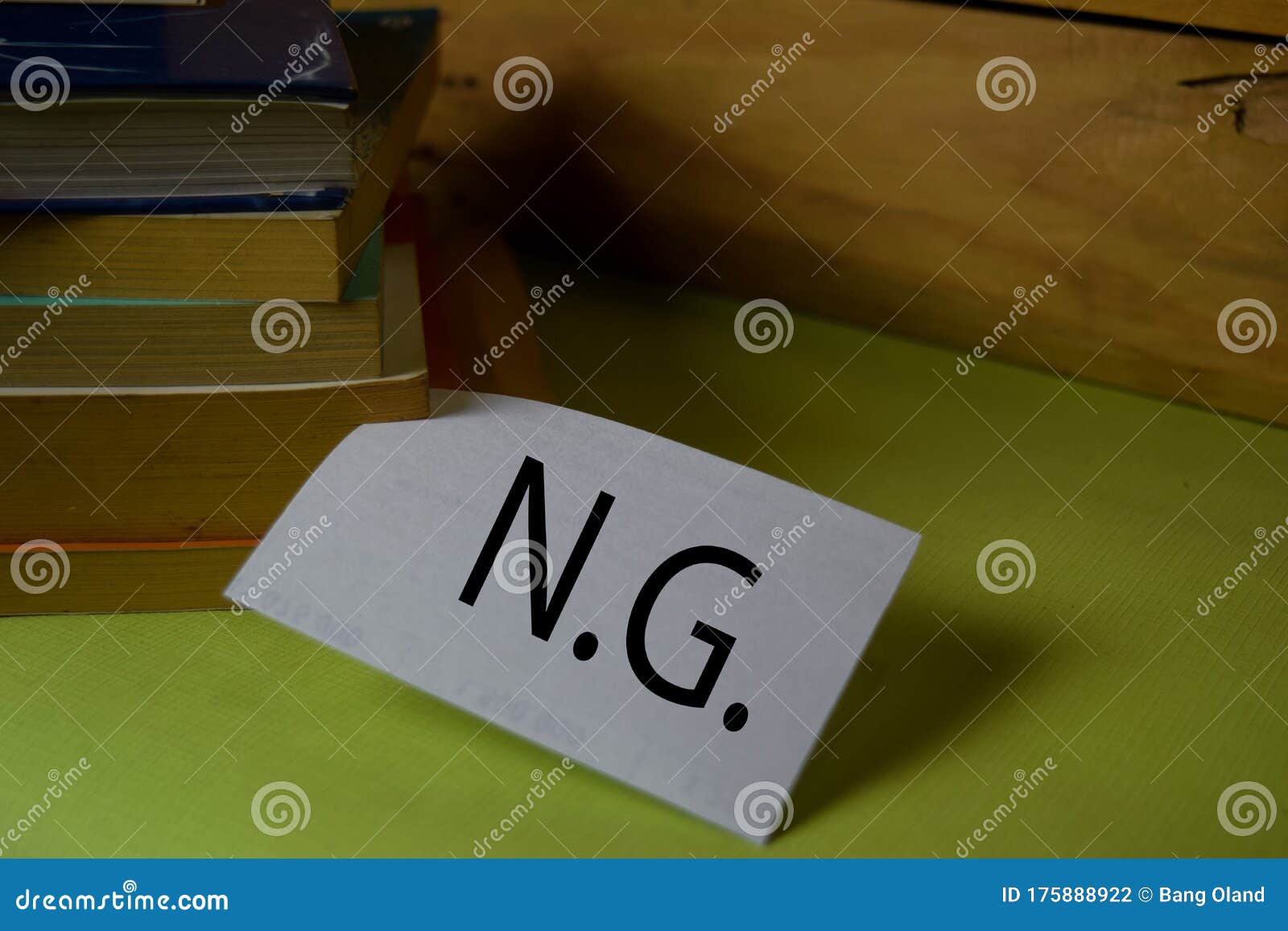 NG Write on a Sticky Note Isolated on Office Desk. Business Document ...