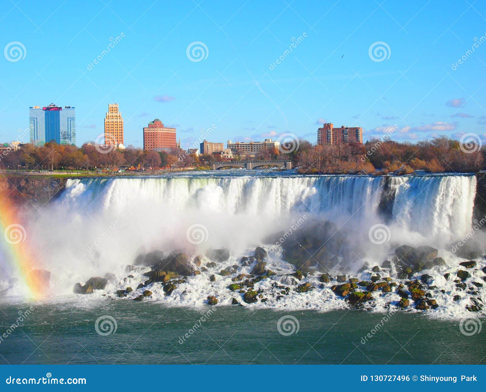 Niagara Falls with a Rainbow on a Day with Blue Sky Canada Stock Photo ...